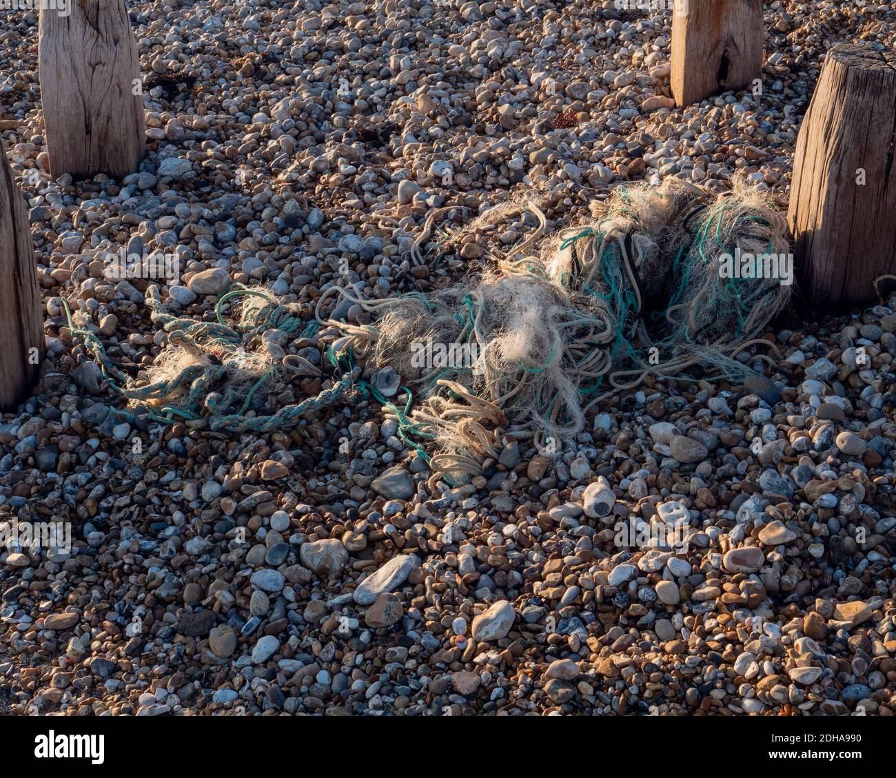 Discarded ropes and parts of fishing nets seen on the pebble and ...