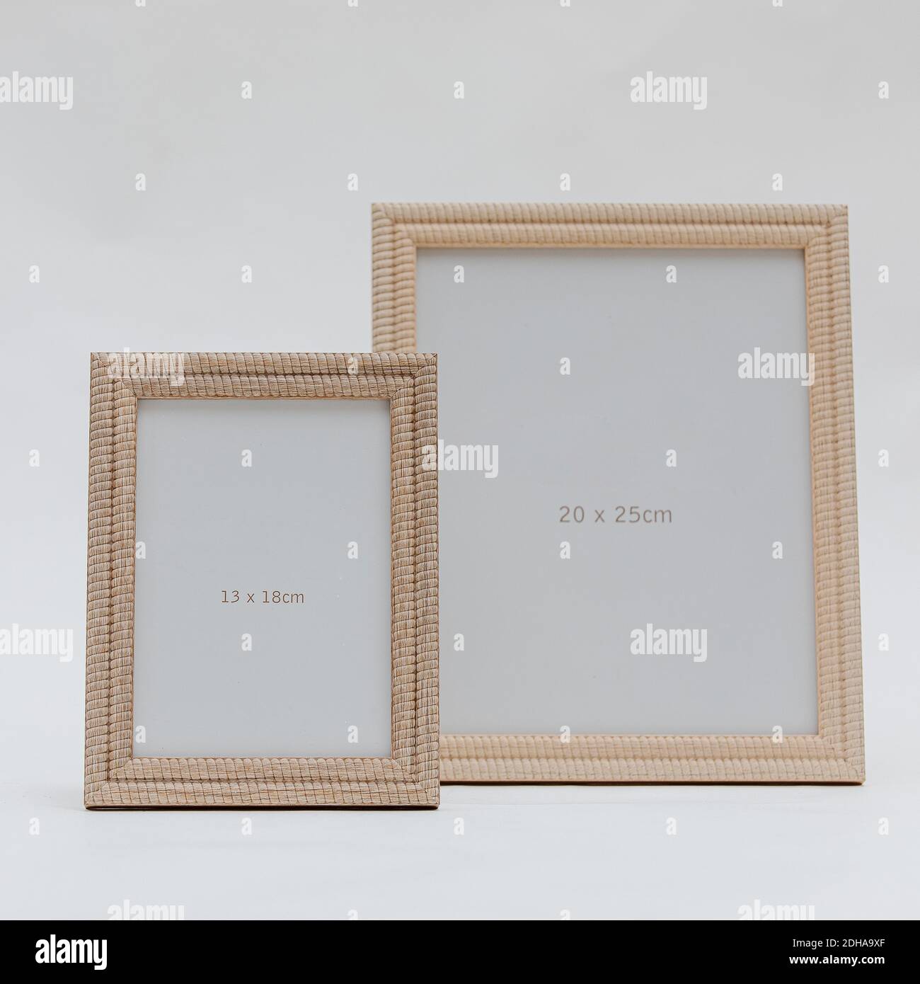 A vertical shot of wooden photo frame on an isolated white background ...