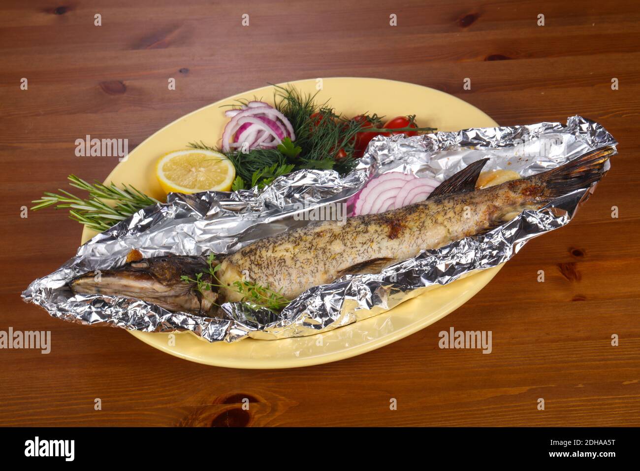 Stuffed baked pike with lemon and rosemary Stock Photo - Alamy