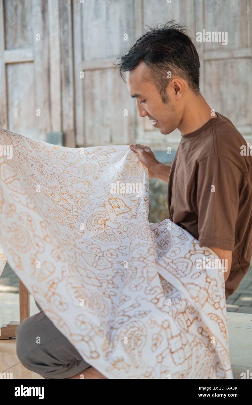 portrait young men see the results of these batik drawings. traditional ...