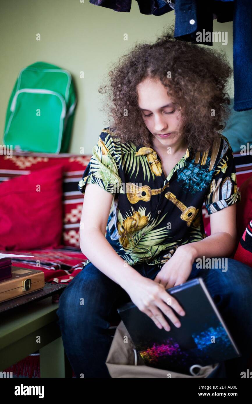 Boy putting books backpack hi-res stock photography and images - Alamy