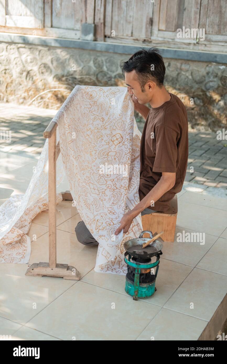 portrait young men see the results of these batik drawings. traditional ...