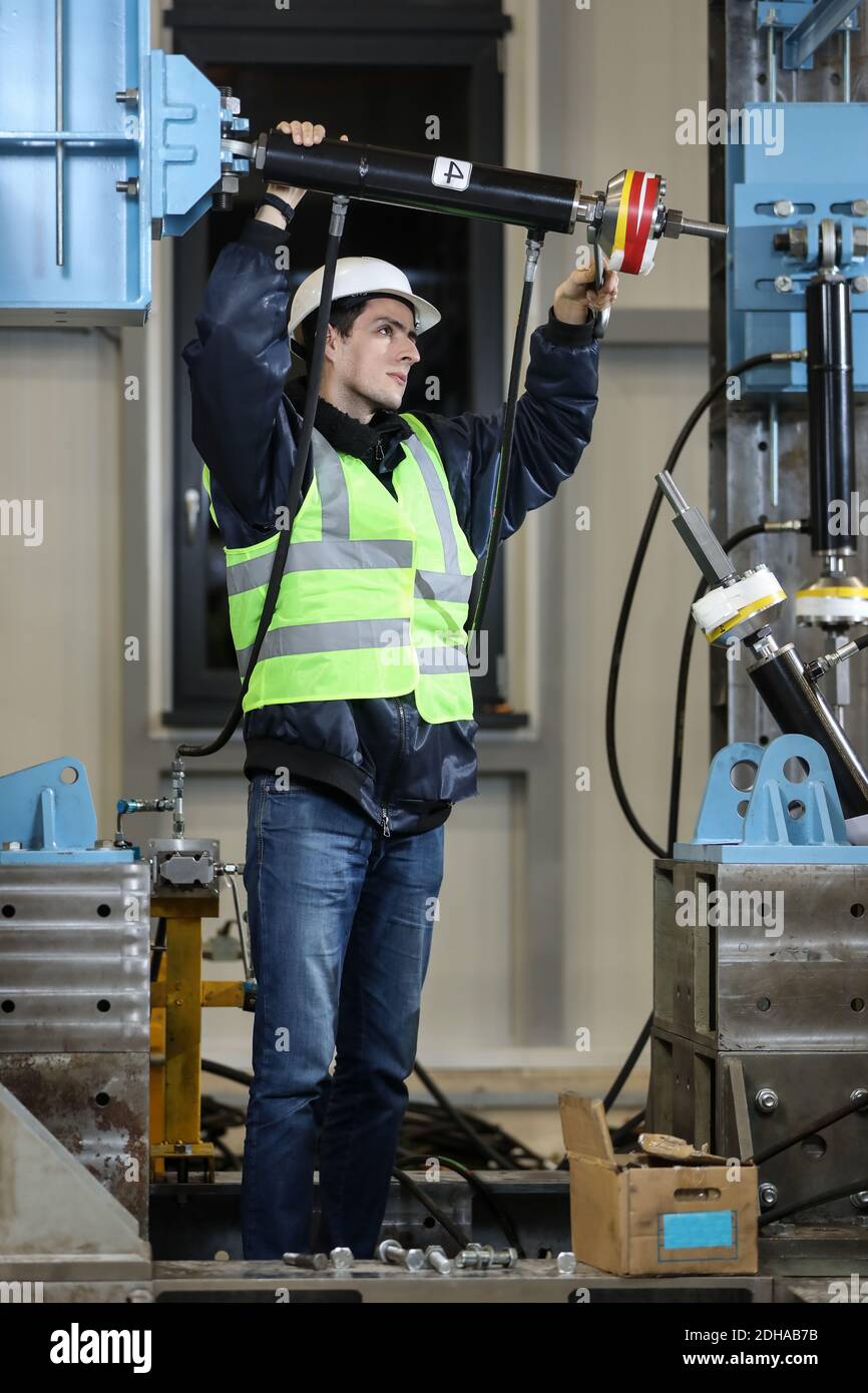 Portrait of a Caucasian man , factory engineer in work clothes ...
