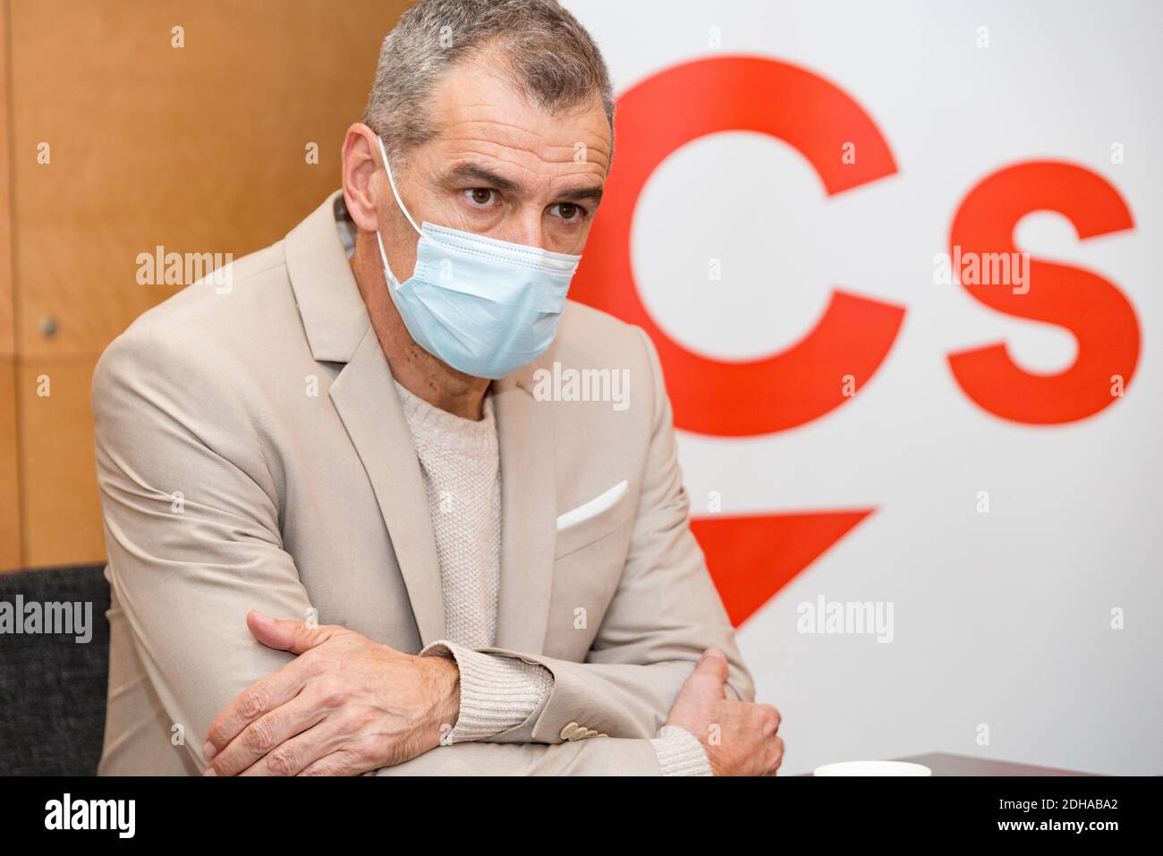 Toni Canto wearing a face mask attends an interview in his office at ...
