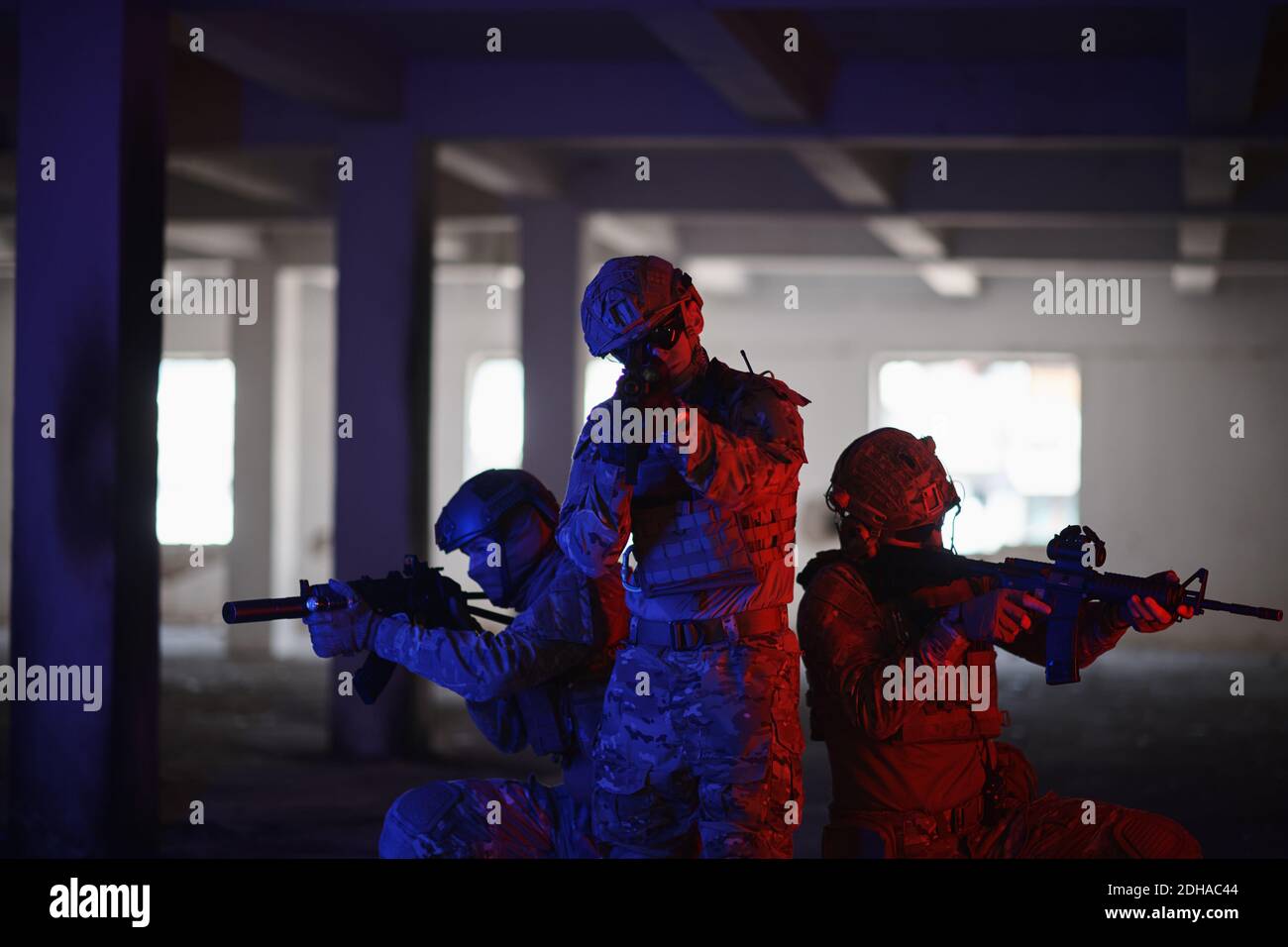 Soldiers squad in tactical formation having action urban environment ...