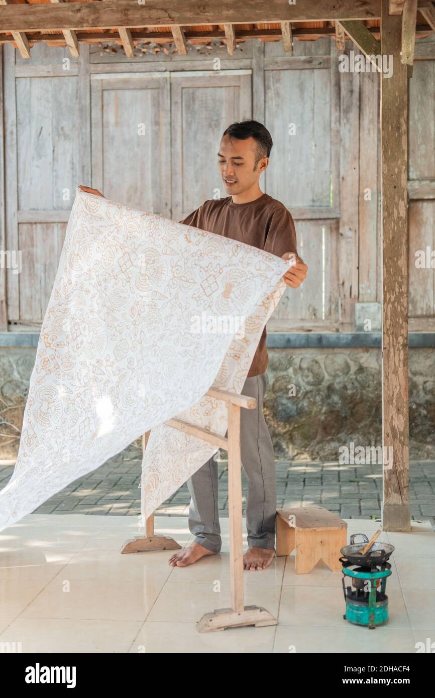 portrait young men see the results of these batik drawings. traditional ...
