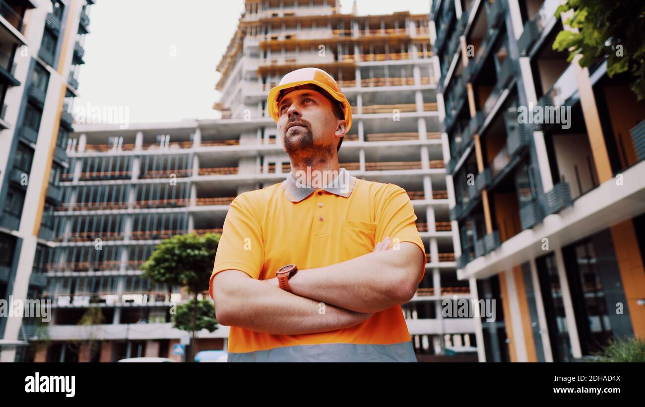 Builder portrait with proud expression. Successful constructor or ...