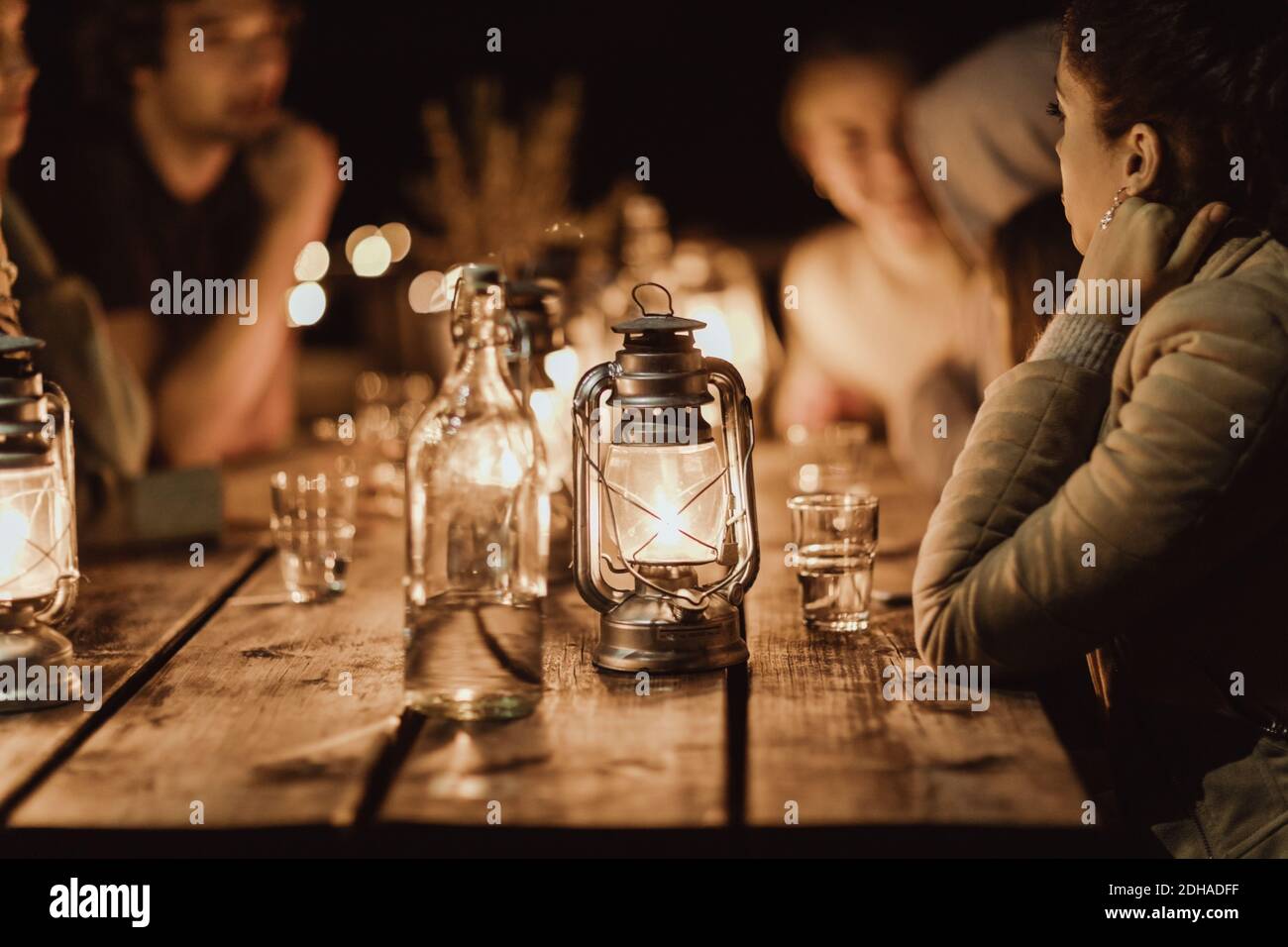 Mixed people sitting around table hi-res stock photography and images ...