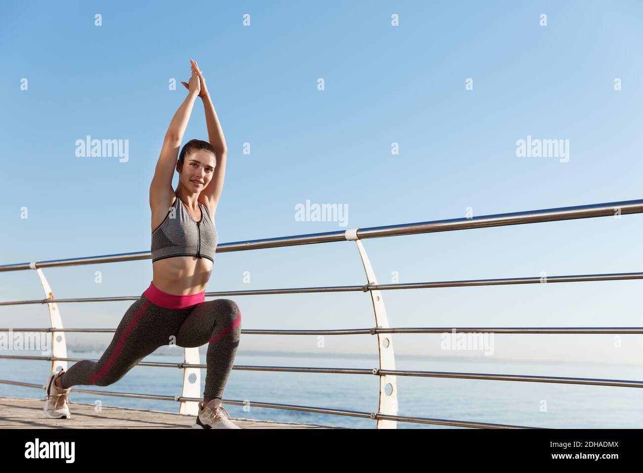 Image of fit and healthy fitness woman working out alone near the sea ...