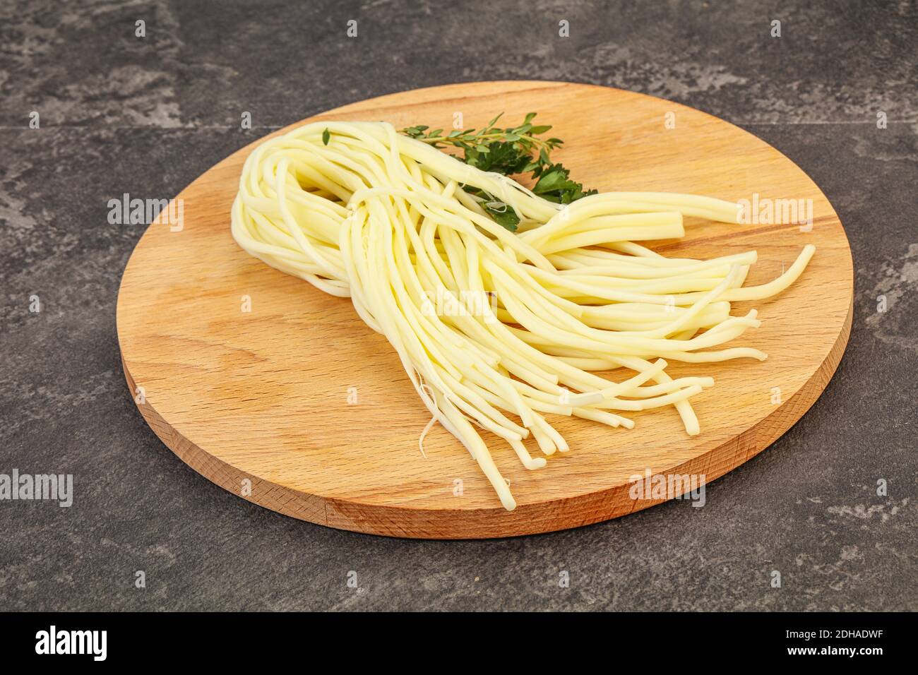 Chechil spaghetti cheese snack over board Stock Photo - Alamy