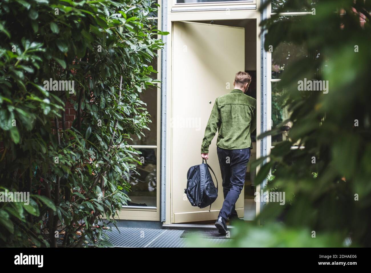 Person entering a house hi-res stock photography and images - Alamy