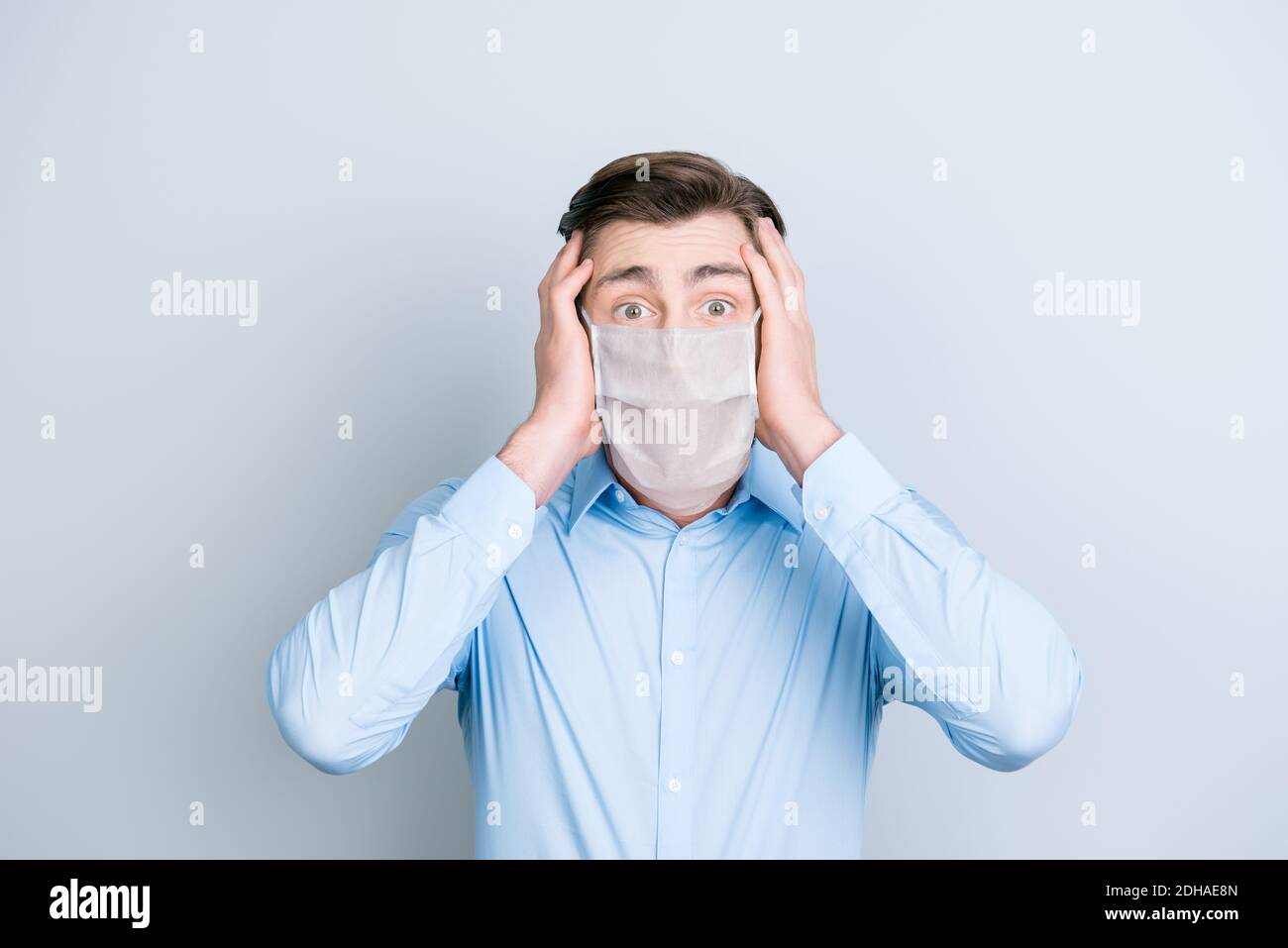 Close-up portrait of stunned guy wearing safety mask mers cov disease ...