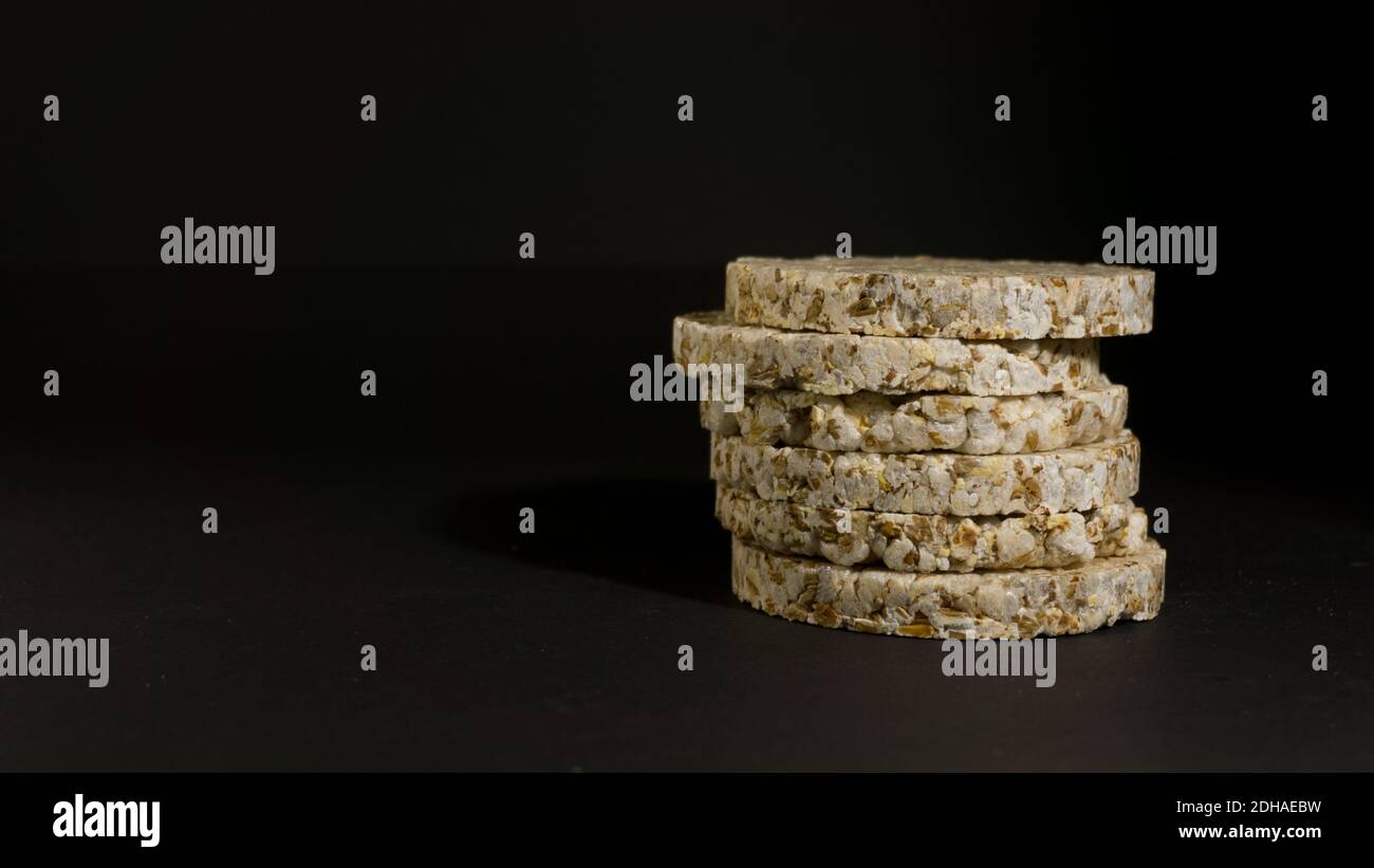 Grain crispbreads crispy rice and diet bread. Stack of puffed whole ...