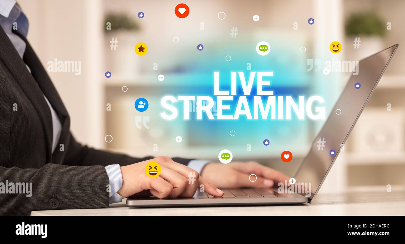 Freelance woman using laptop with LIVE STREAMING inscription, Social ...