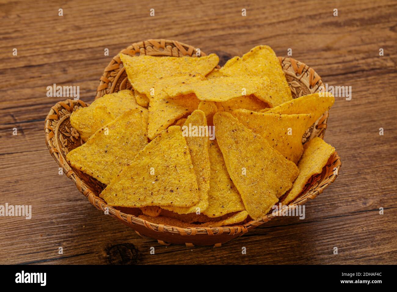 Mexican crunchy corn nachos triangle heap Stock Photo - Alamy