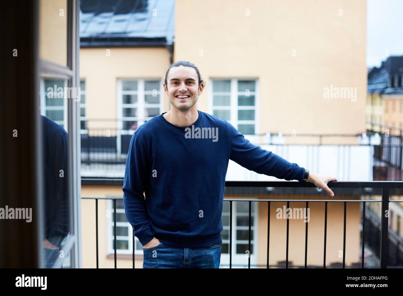 Man standing at balcony hi-res stock photography and images - Alamy