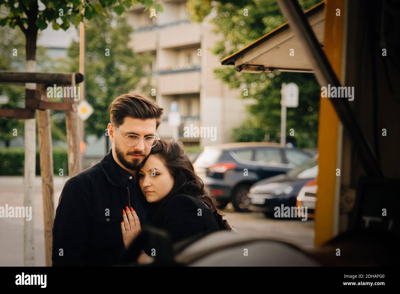 Couple embracing sad hi-res stock photography and images - Alamy