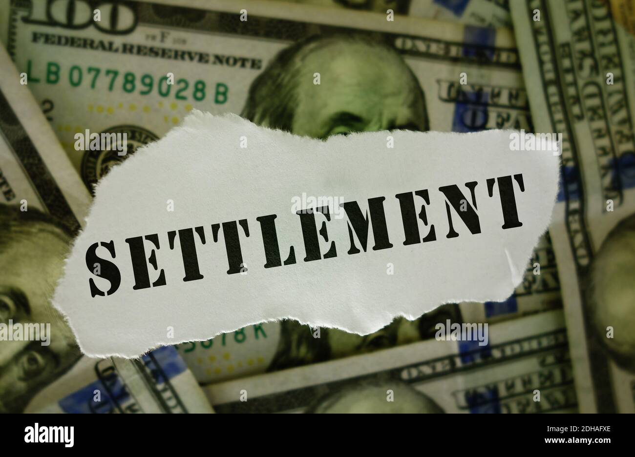Settlement message on money Stock Photo - Alamy