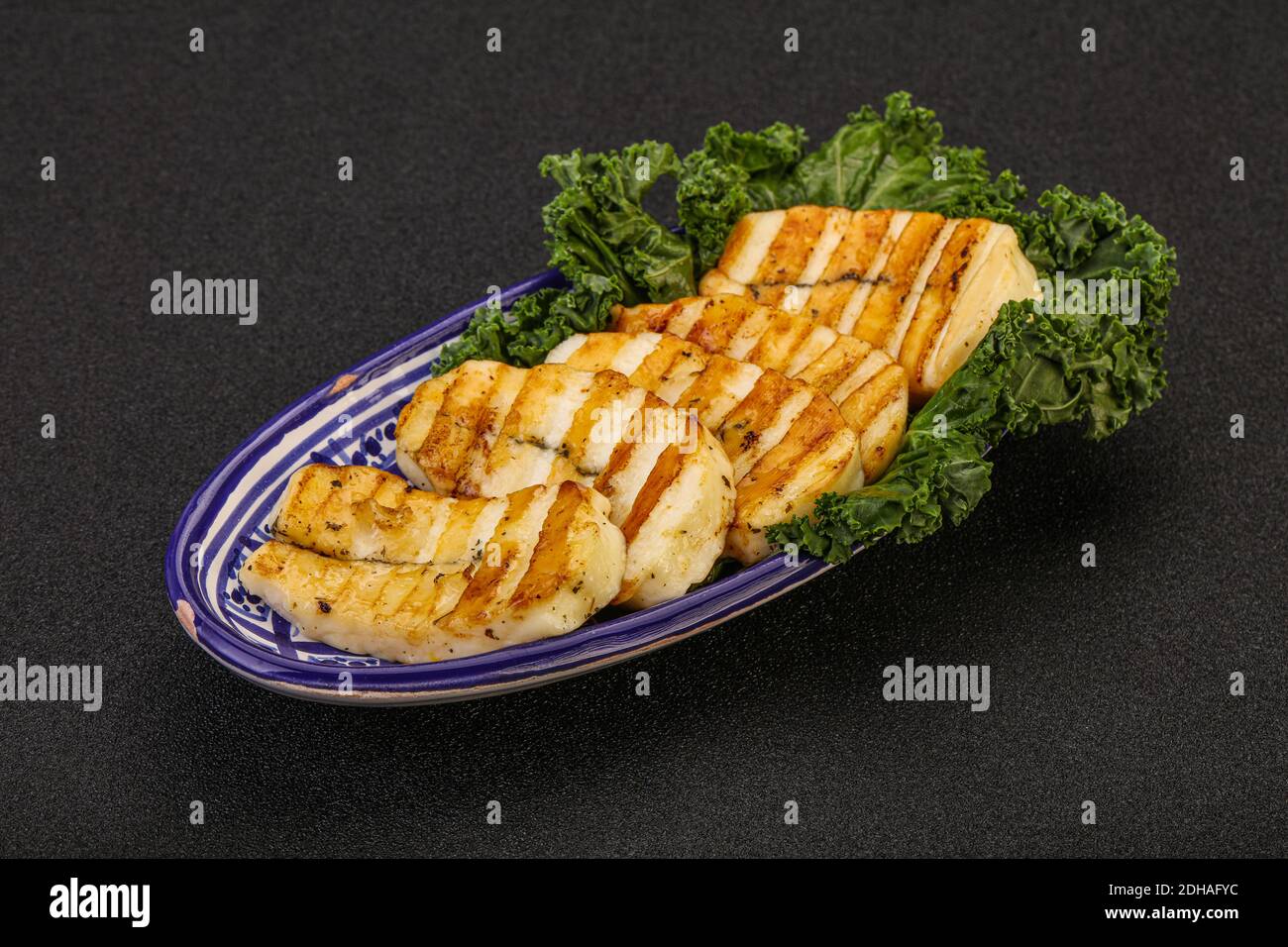 Grilled Greek haloumi cheese with herbs and spices Stock Photo - Alamy