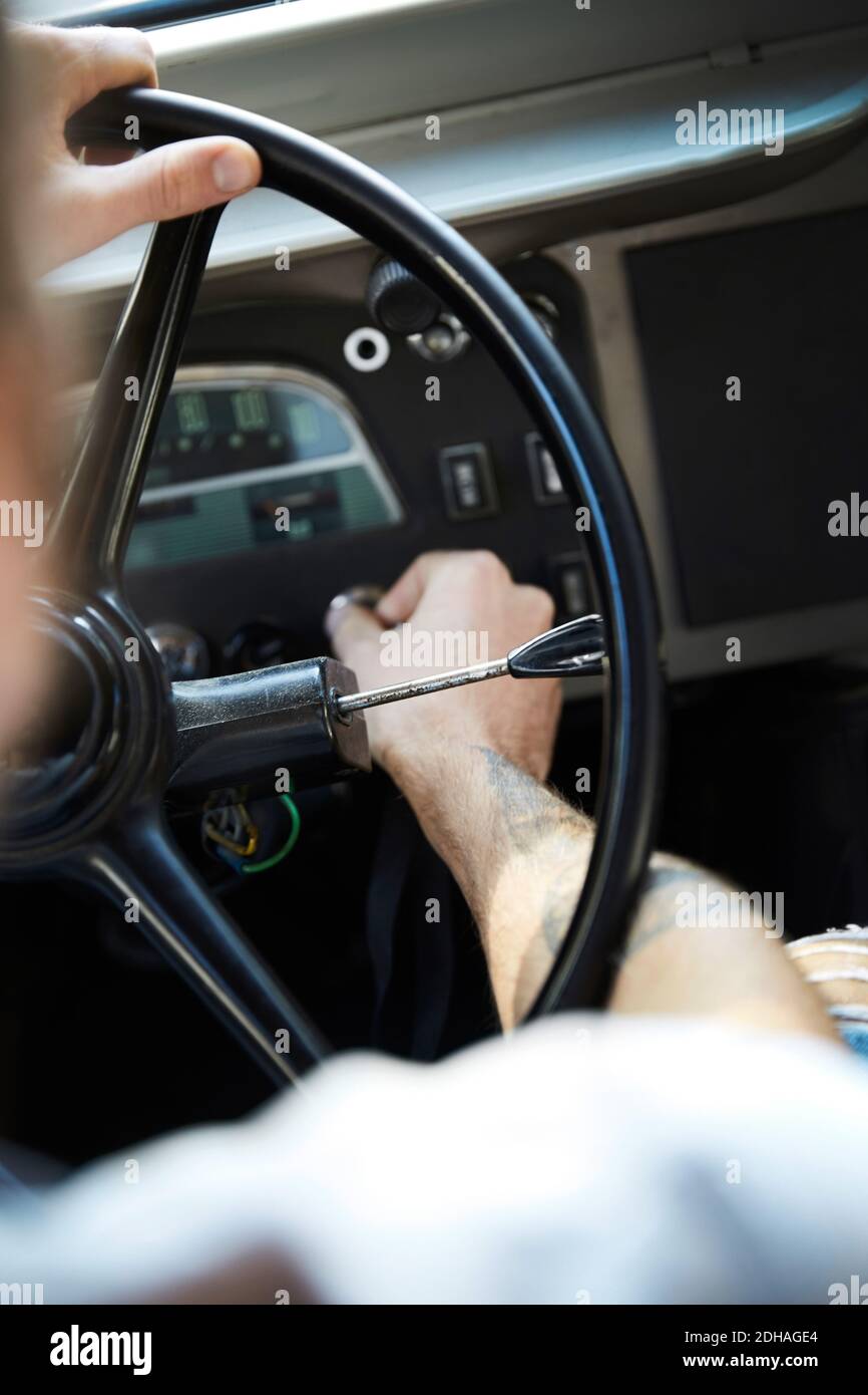 Over the shoulder view of driver starting food truck Stock Photo - Alamy