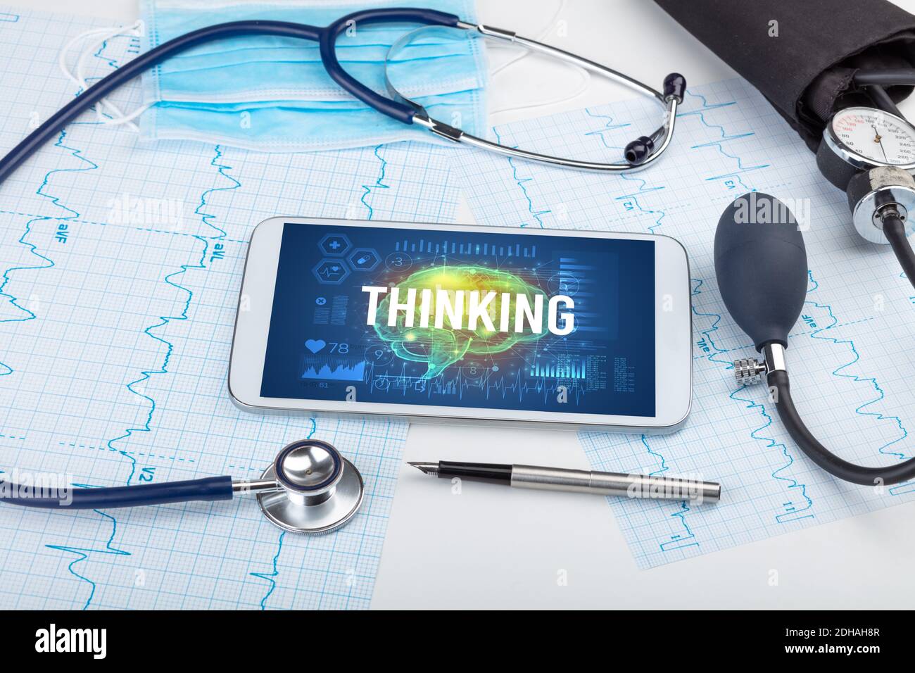 Tablet pc and medical tools with THINKING inscription, social ...
