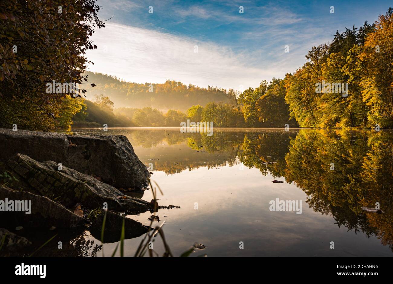 Lake fog landscape with Autumn foliage and tree reflections in Styria ...