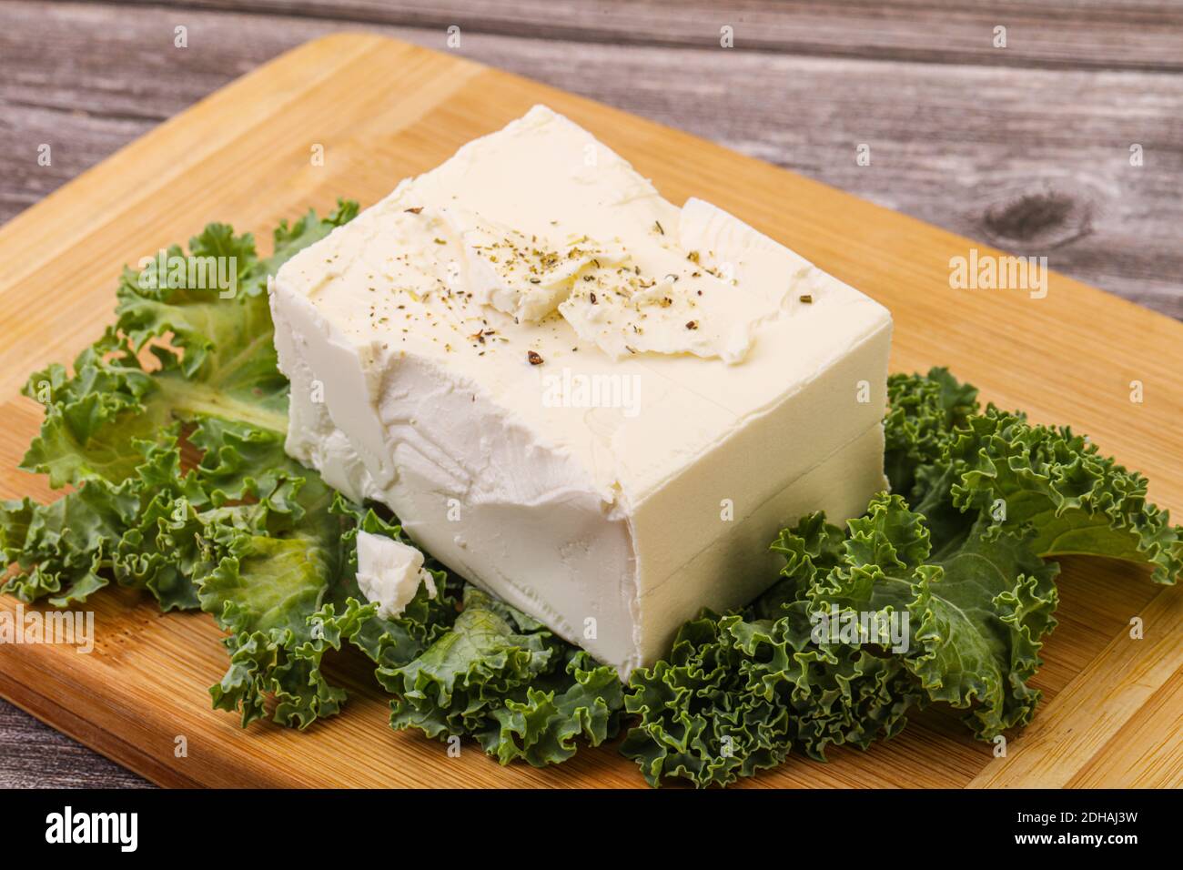 Traditional tasty Greek Feta soft cheese brick Stock Photo - Alamy