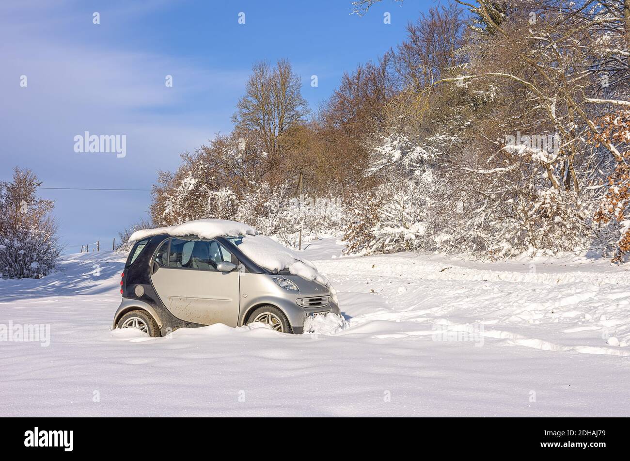 Accidental and off-road snowed-in car of the Smart brand Stock Photo ...
