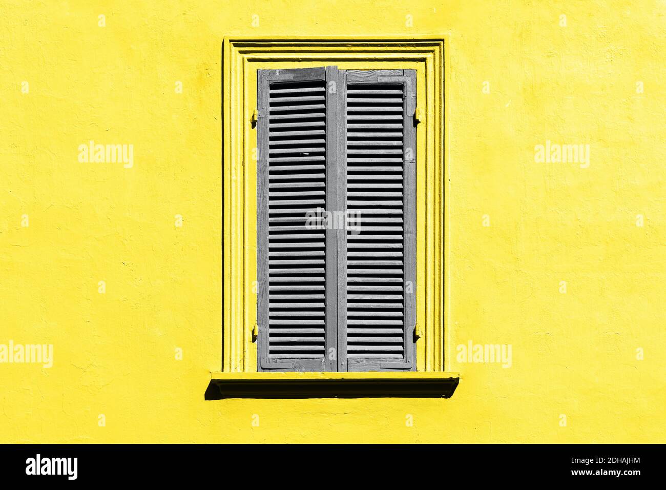 Ultimate grey and illuminating yellow. Gray shutters on the window ...