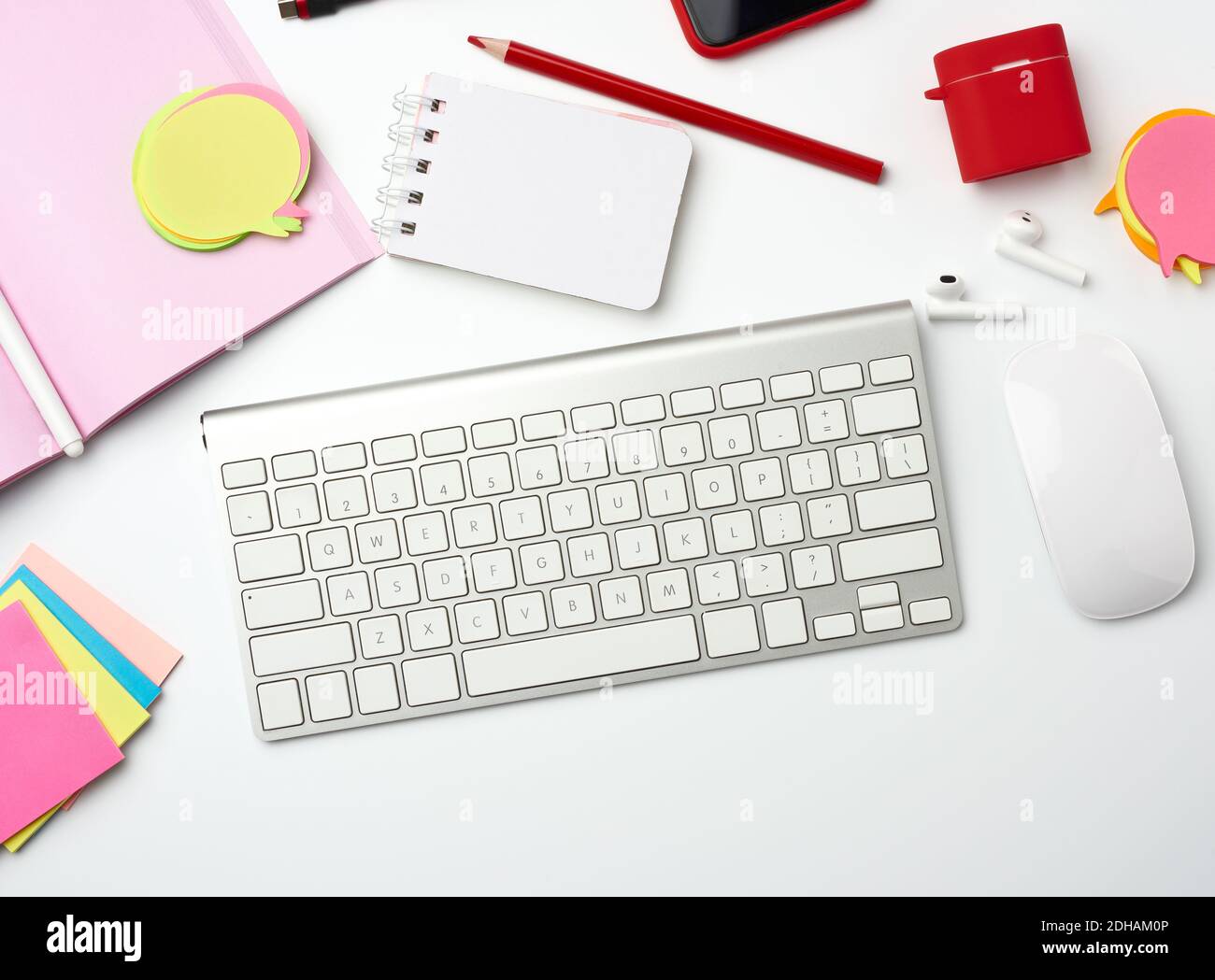 White wireless keyboard, computer mouse and paper notebook Stock Photo ...