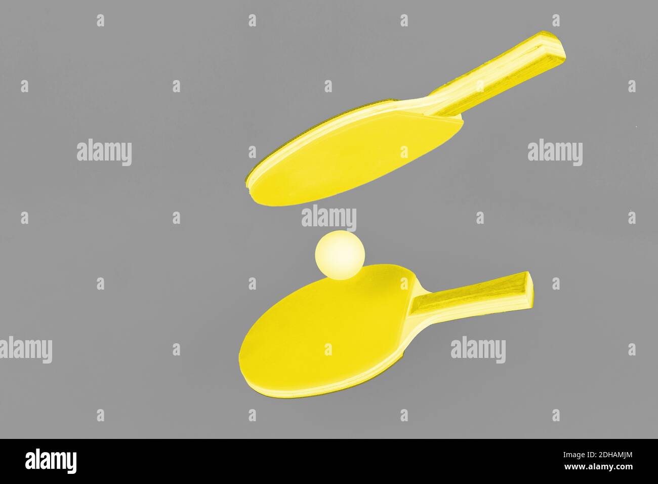 Illuminating yellow ping pong rackets on Ultimate Gray background Stock ...
