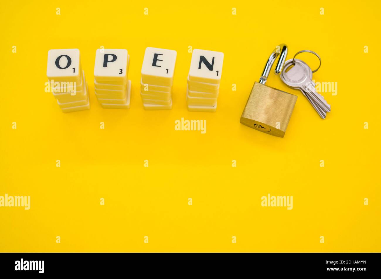 The four white letter block stacks forming the word OPEN with padlock ...
