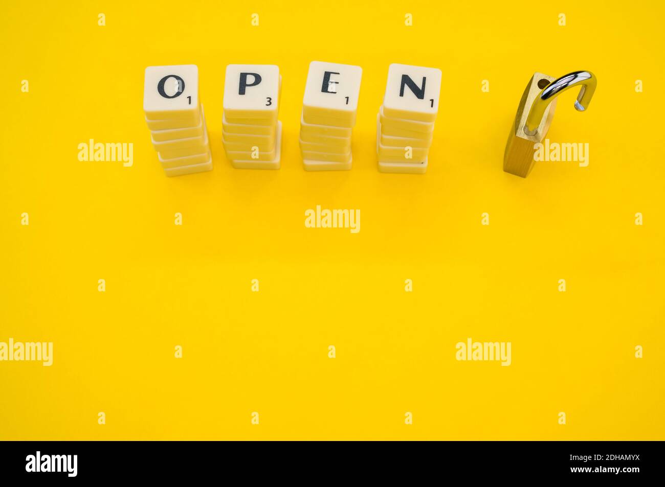 The four white letter block stacks forming the word OPEN with a padlock ...