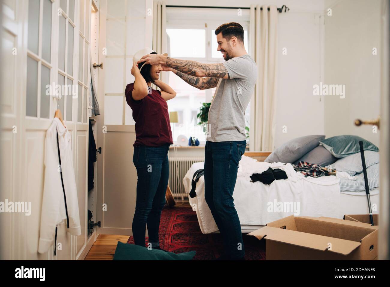 Adjusting hat hi-res stock photography and images - Alamy