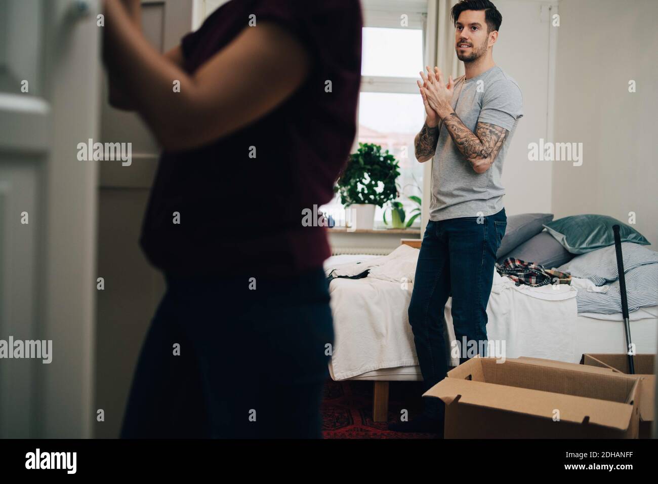 Man standing cabinet home cabinet hi-res stock photography and images ...