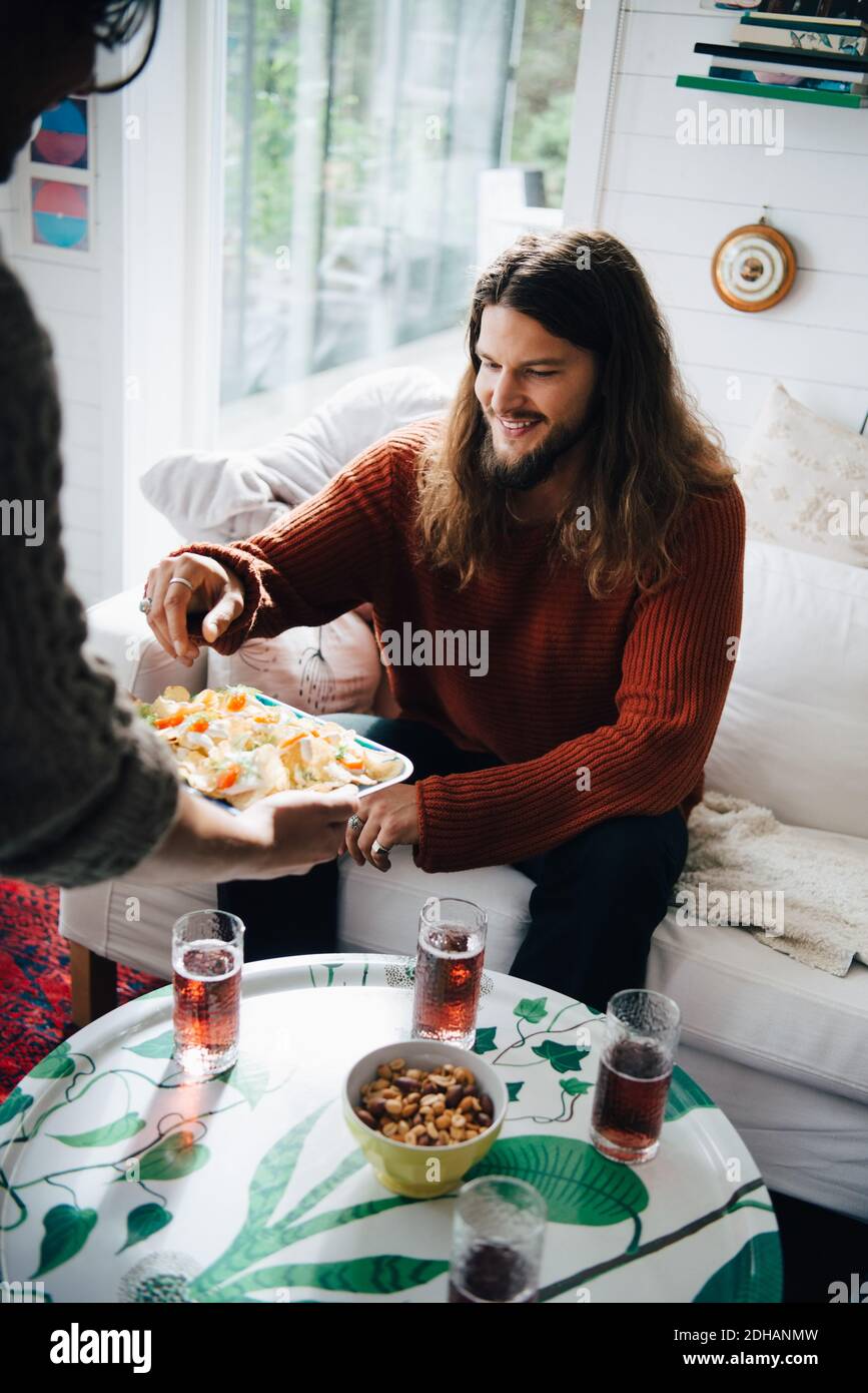 Man eating snack foods hi-res stock photography and images - Alamy