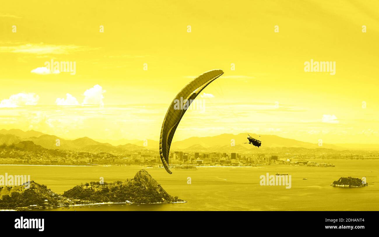 A parachute with skydiver on sunny sky background. Concept of Color of ...