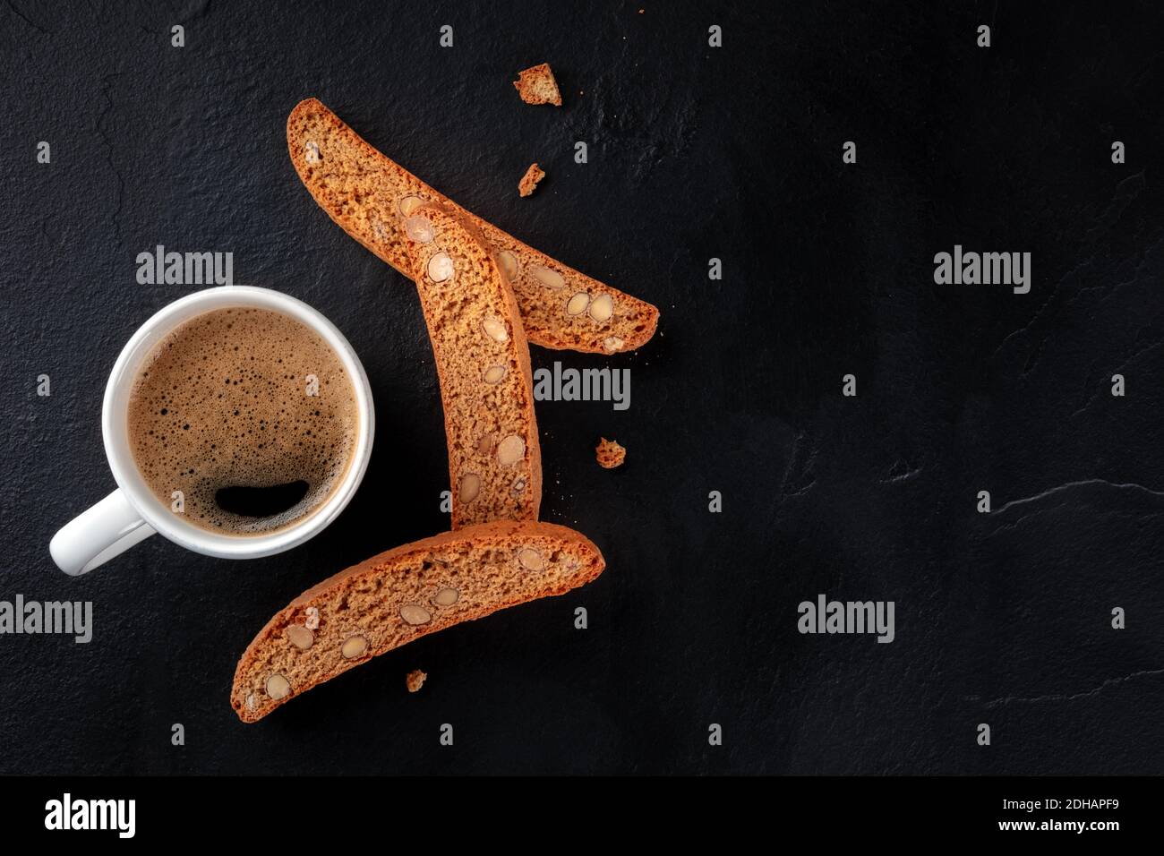 Biscotti. Italian almond biscuits with a cup of coffee, shot from above ...