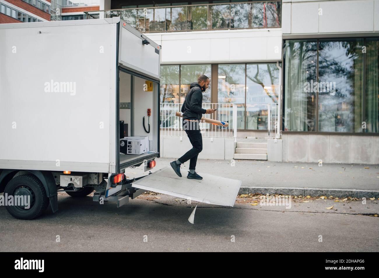Male courier delivery service walking hi-res stock photography and ...