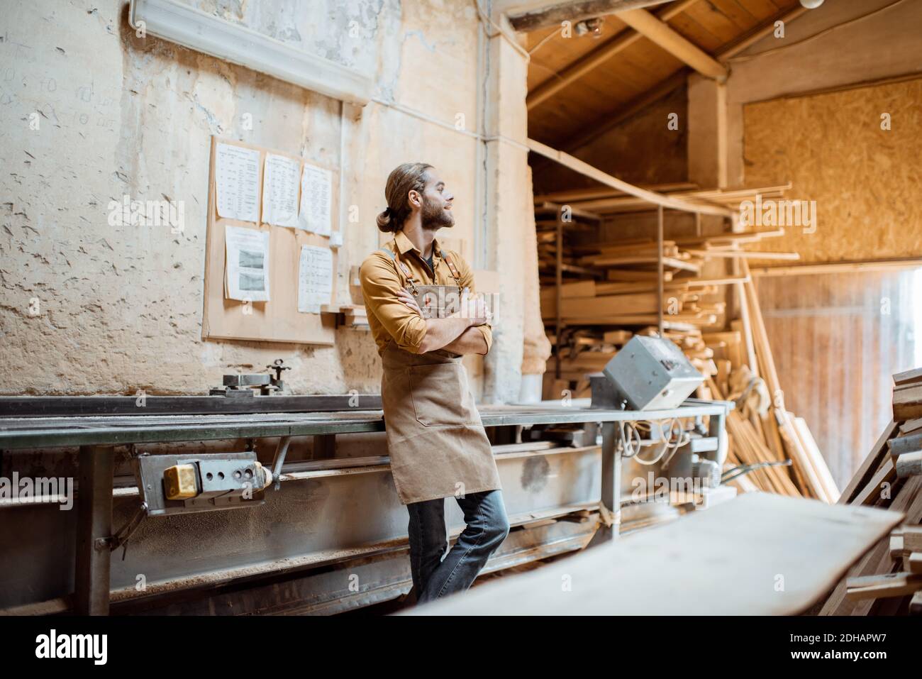 Portrait of a carpenter at the wood storage at the carpentry Stock ...