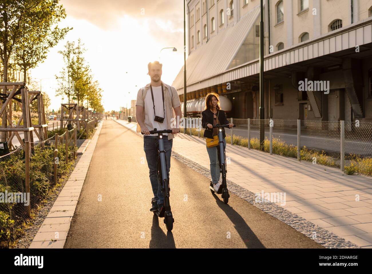Woman riding on back scooter hi-res stock photography and images - Alamy