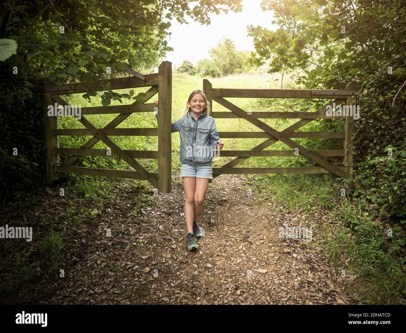 Girl by wooden gate hi-res stock photography and images - Alamy