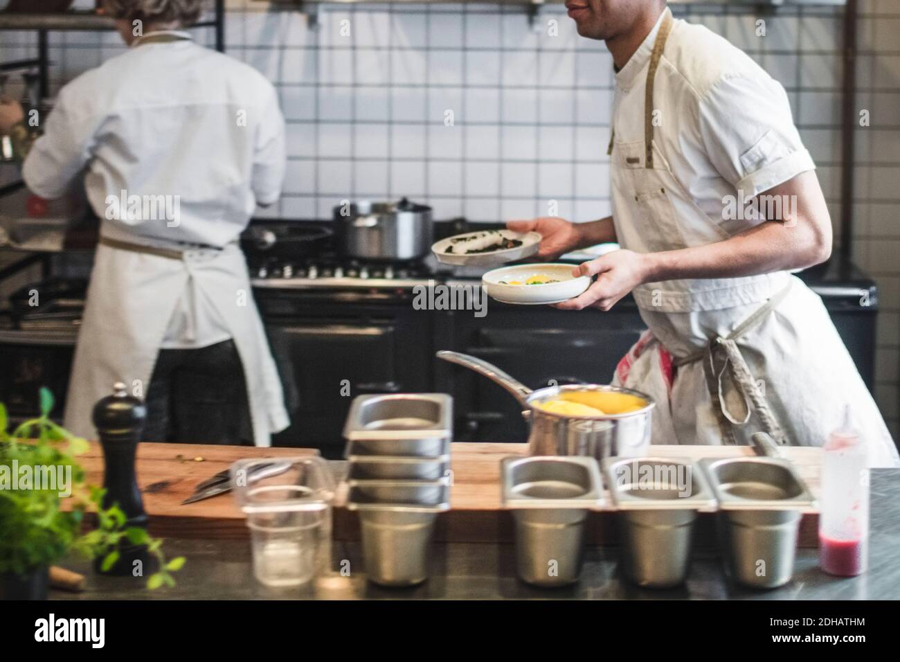 Waiter holding plates foods hi-res stock photography and images - Alamy