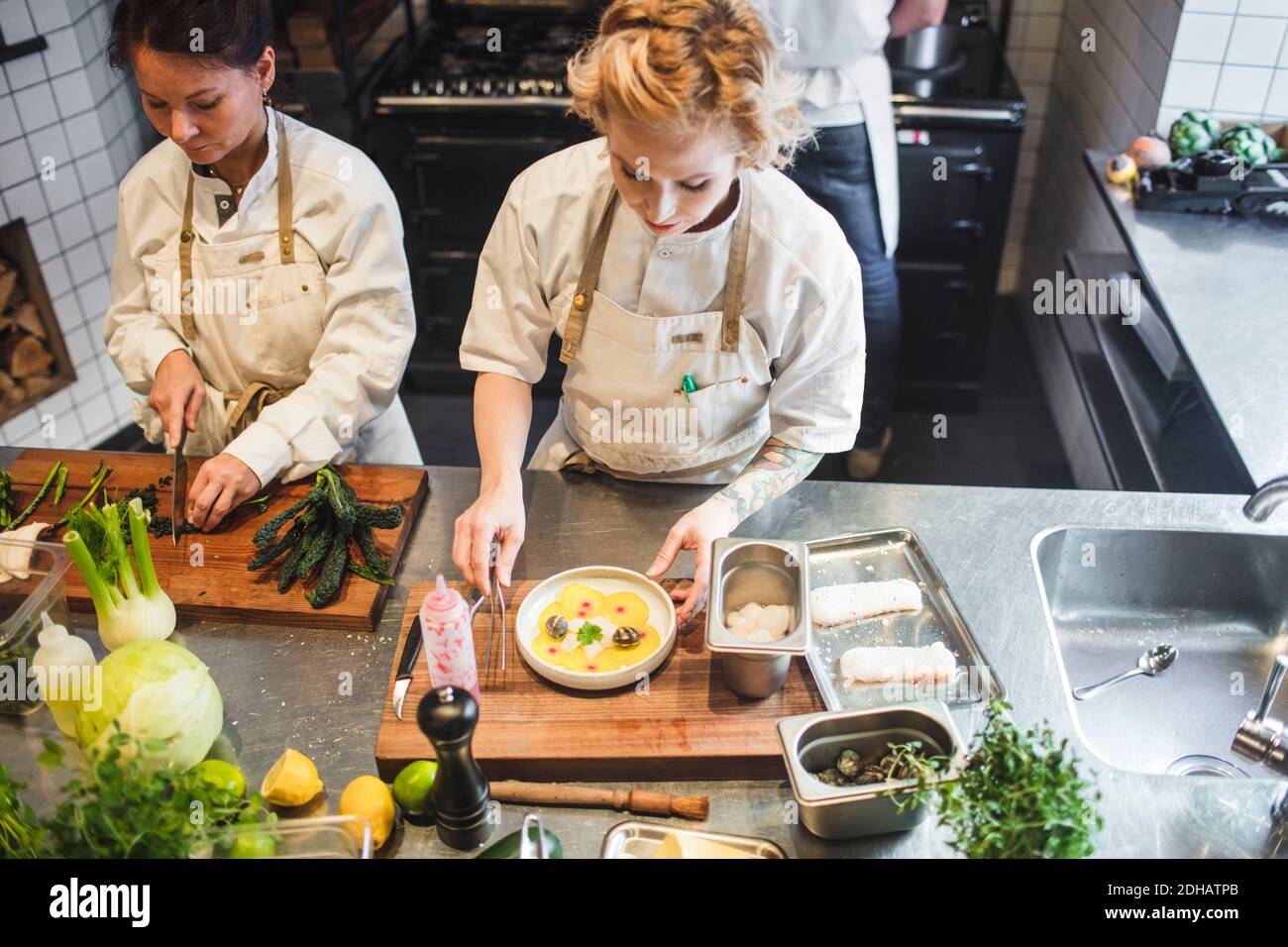 Working at counter hi-res stock photography and images - Alamy