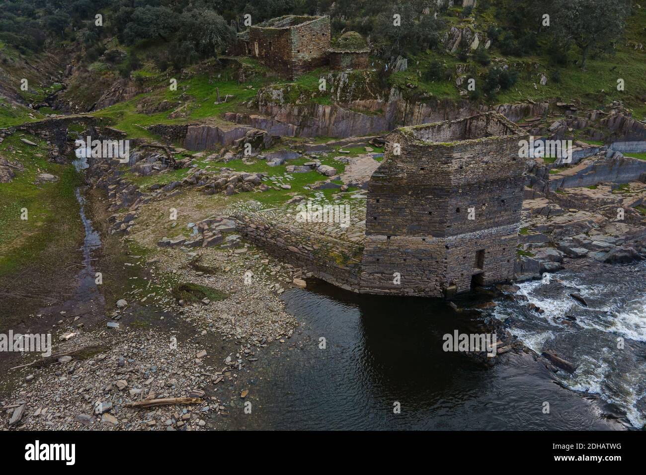 A mill tower and other ancient ruins on the bank of the Alagon River ...