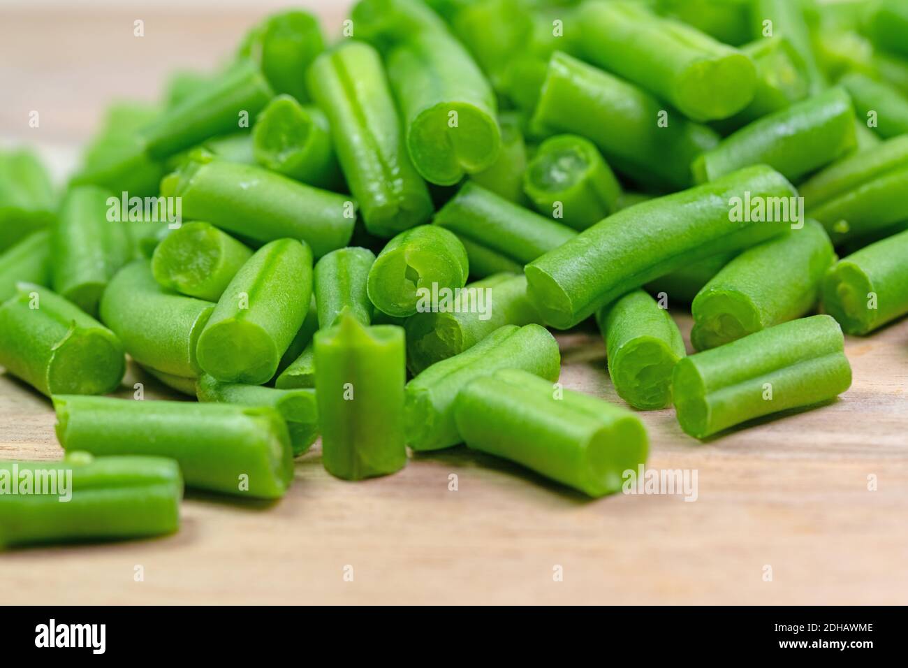 Sliced green beans against white background Stock Photo - Alamy