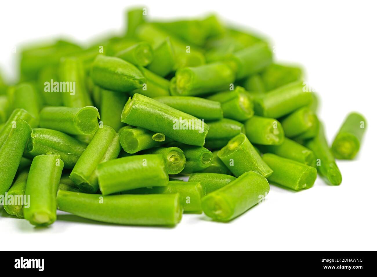 Sliced green beans against white background Stock Photo - Alamy