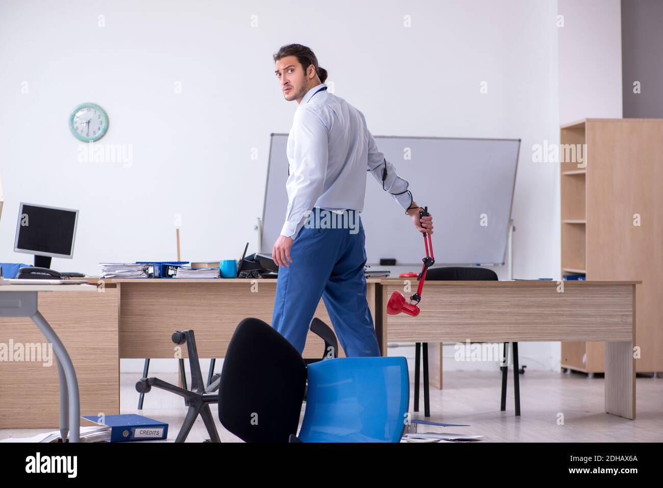 Angry male employee destroying hi-res stock photography and images - Alamy