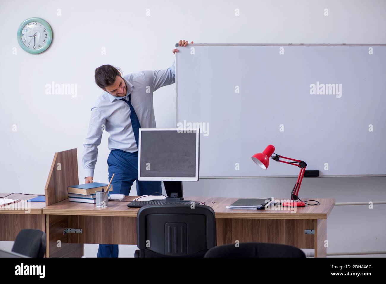 Angry male employee destroying hi-res stock photography and images - Alamy