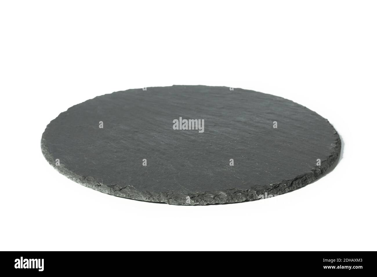 Round black empty slate board isolated on white background. Side view ...